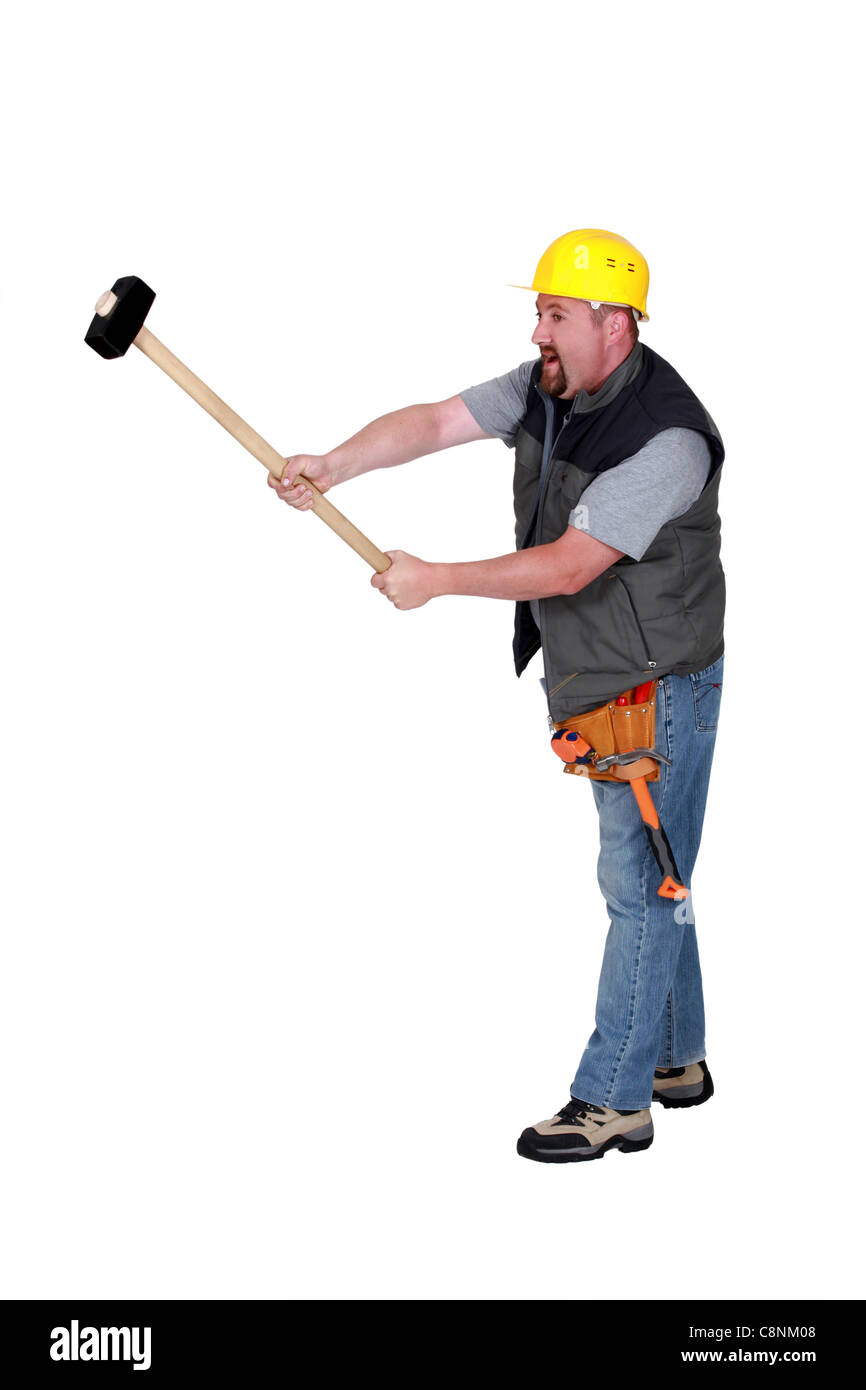 A construction worker with a sledgehammer Stock Photo - Alamy
