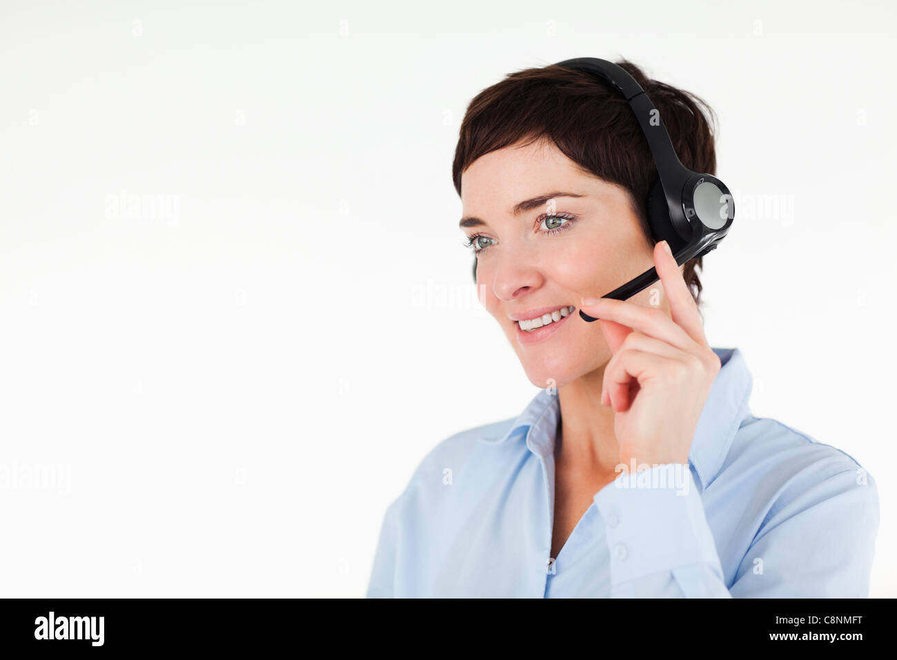 Close up of a office worker using a headset Stock Photo - Alamy