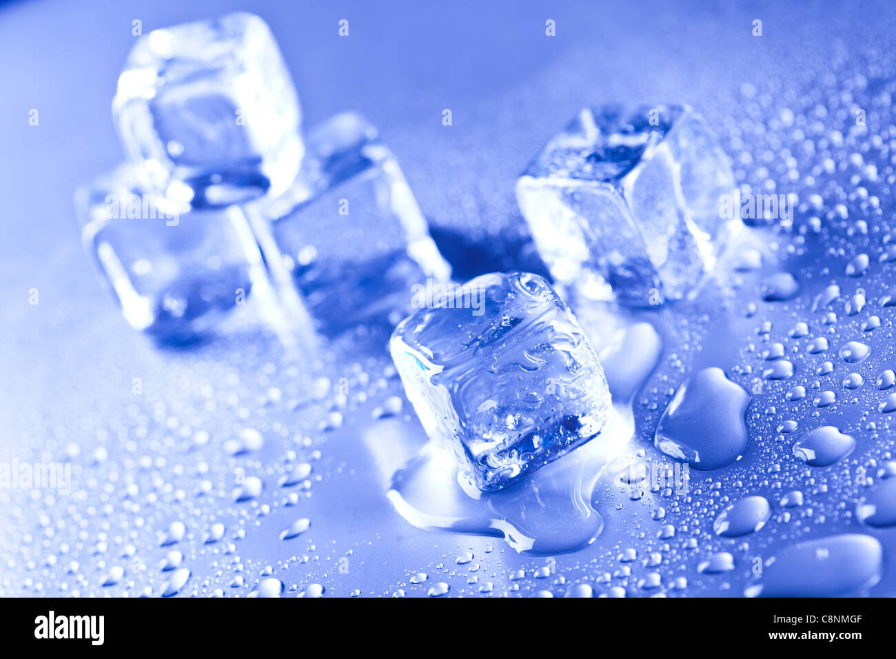 ice cubes and water drops on the blue background Stock Photo - Alamy