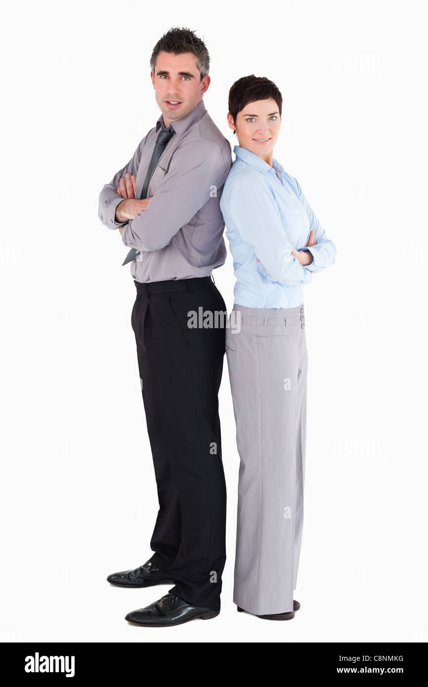 Office workers standing up back to back Stock Photo - Alamy