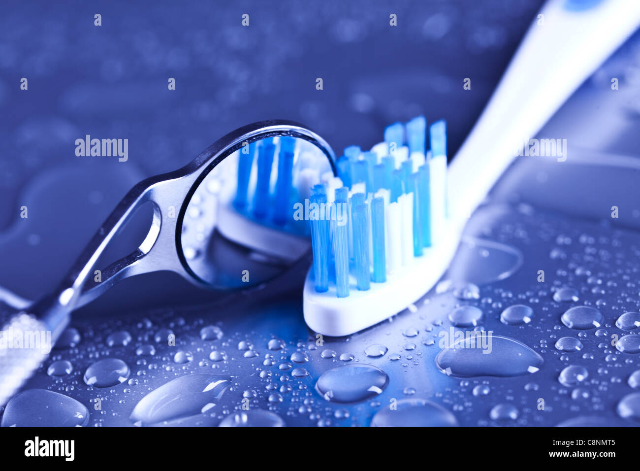 dental care and tooth brushes on the water drops Stock Photo - Alamy