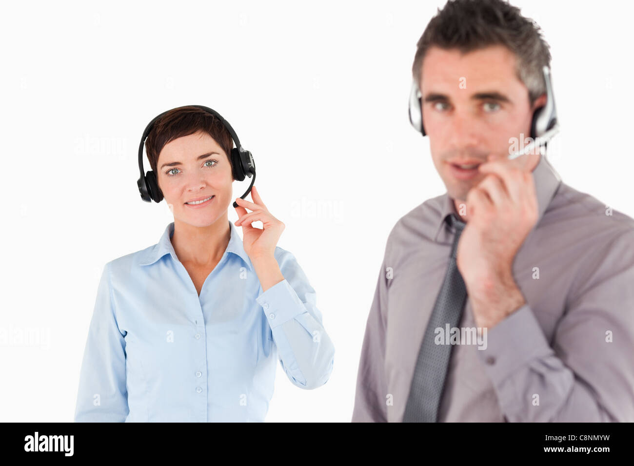 Office workers using headsets Stock Photo - Alamy