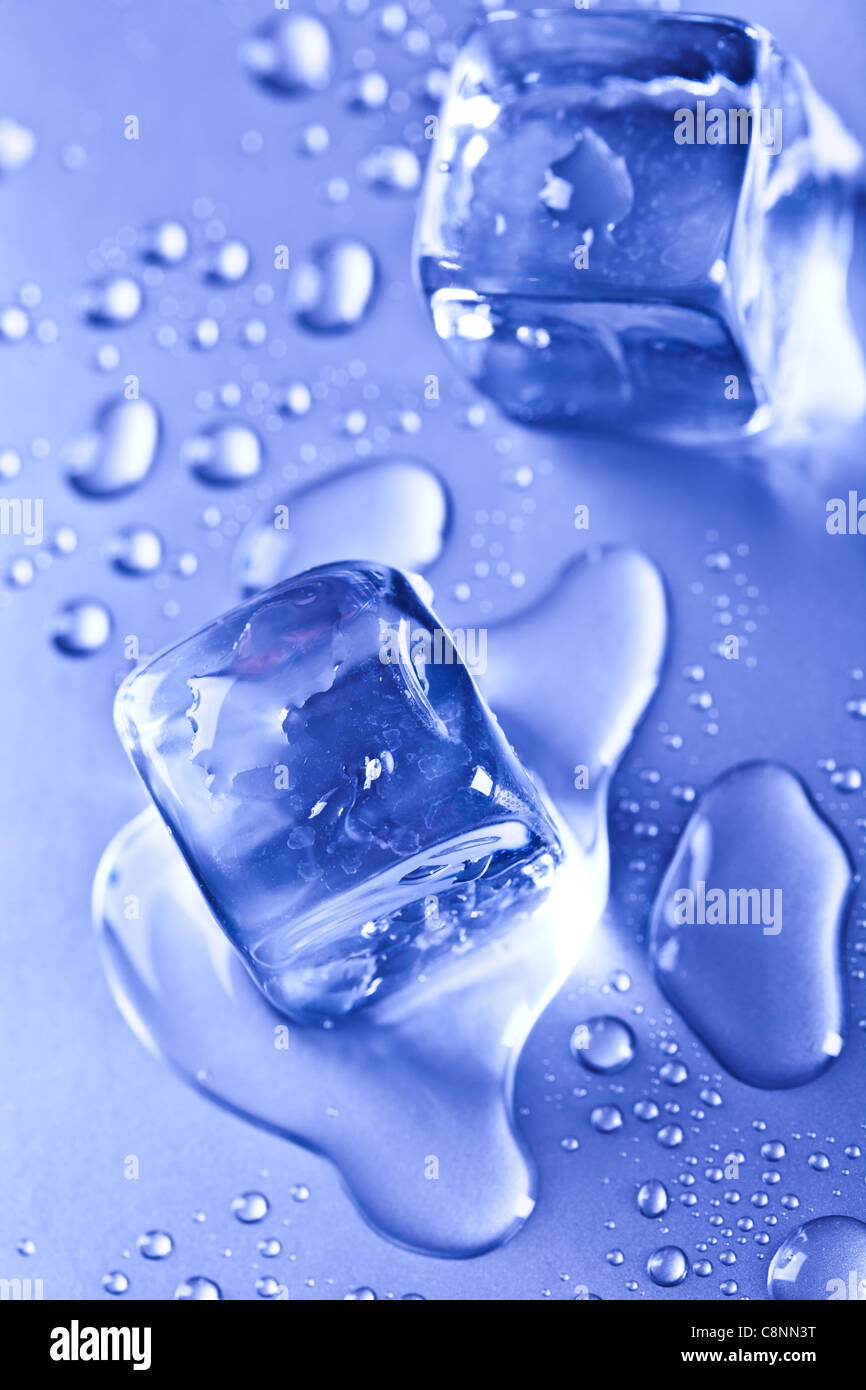ice cubes and water drops on the blue background Stock Photo - Alamy