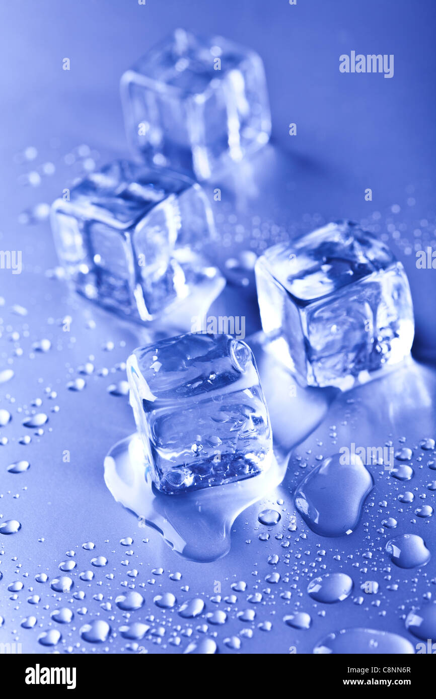 ice cubes and water drops on the blue background Stock Photo - Alamy