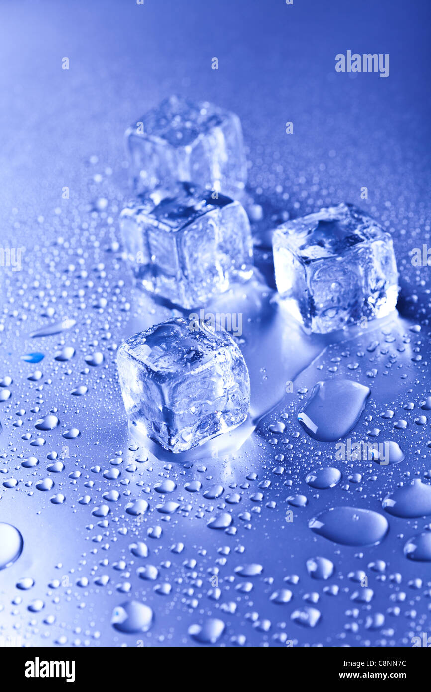 ice cubes and water drops on the blue background Stock Photo - Alamy