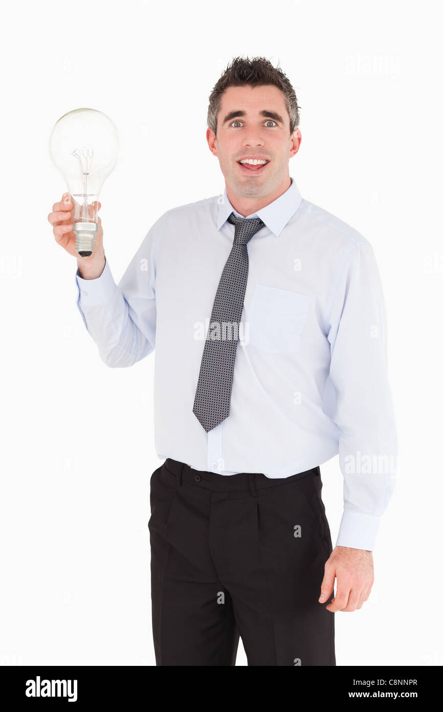 Man holding a light bulb Stock Photo - Alamy