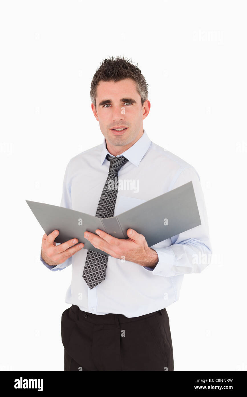 Portrait of a man holding a binder Stock Photo - Alamy