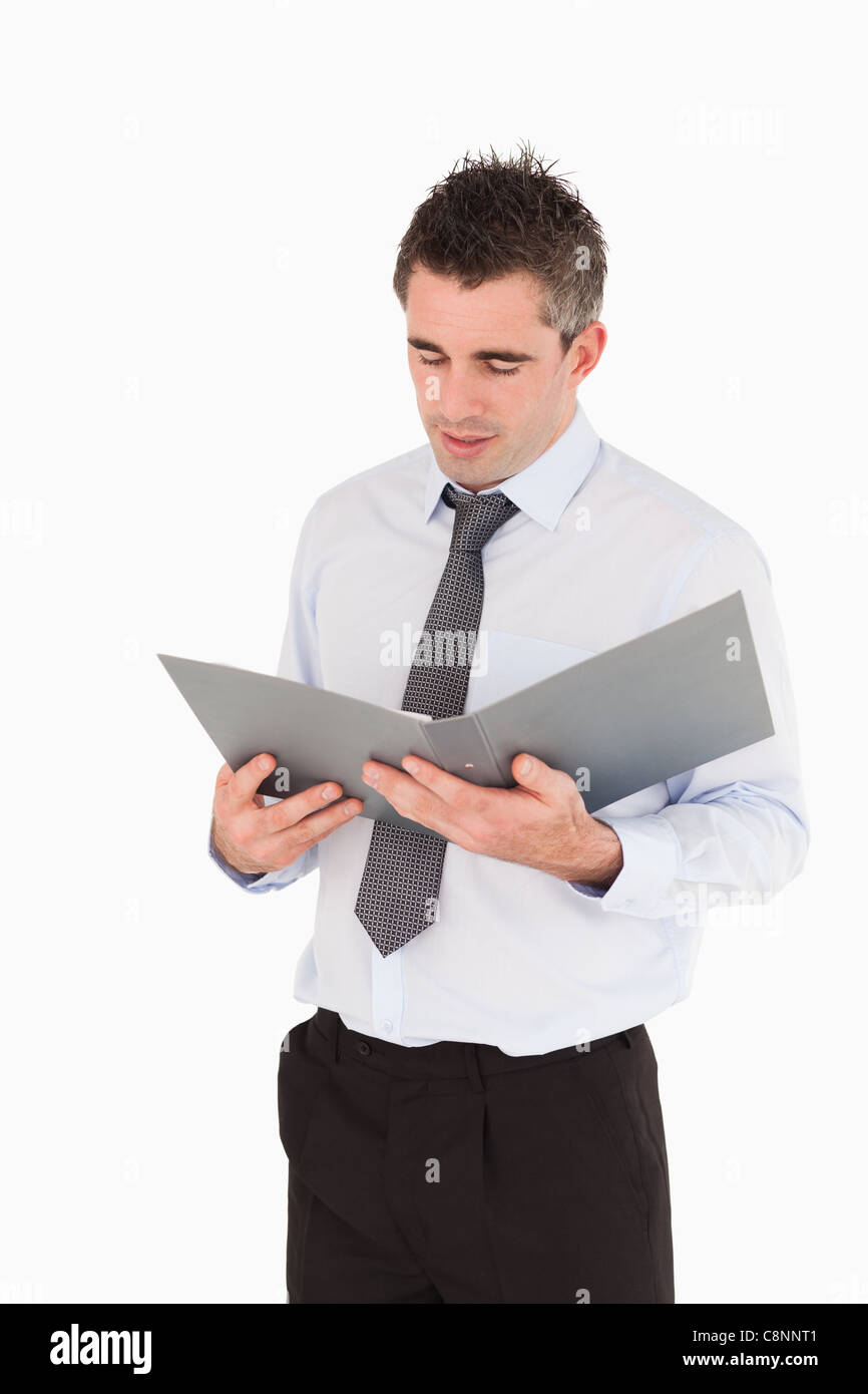 Portrait of a man looking at a binder Stock Photo - Alamy