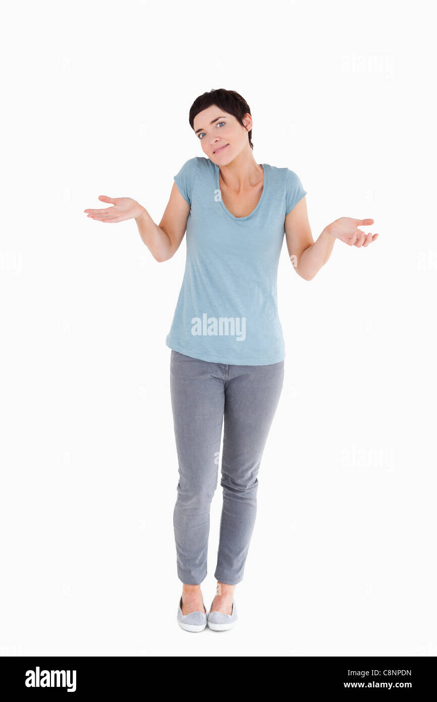 Clueless cute woman posing Stock Photo - Alamy