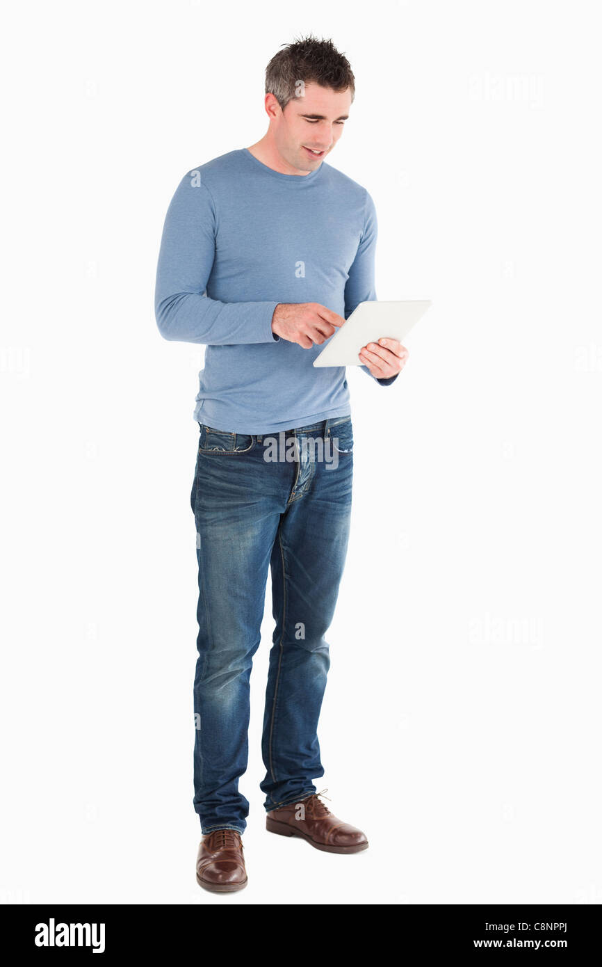 Handsome man using a tablet computer Stock Photo - Alamy
