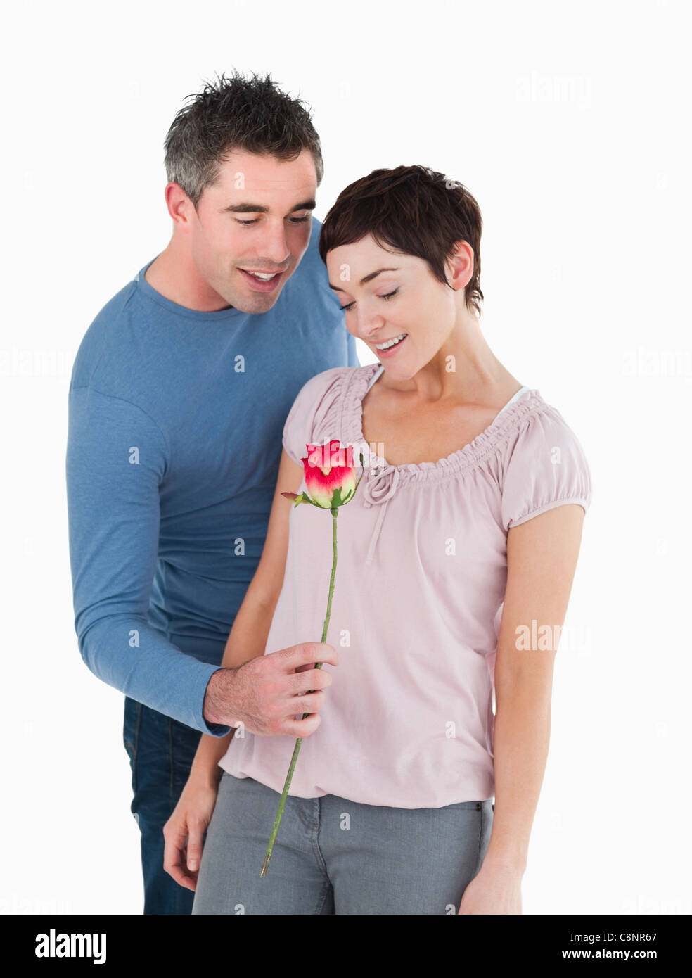 Husband offering a rose to his wife Stock Photo - Alamy