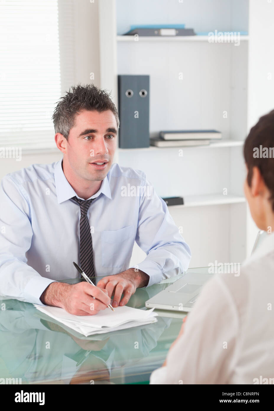 Portrait of a manager interviewing an applicant Stock Photo - Alamy