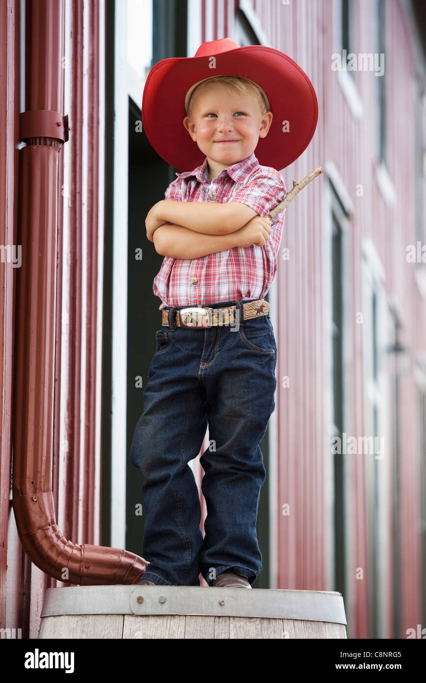 Caucasian cowboy standing on barrel Stock Photo - Alamy