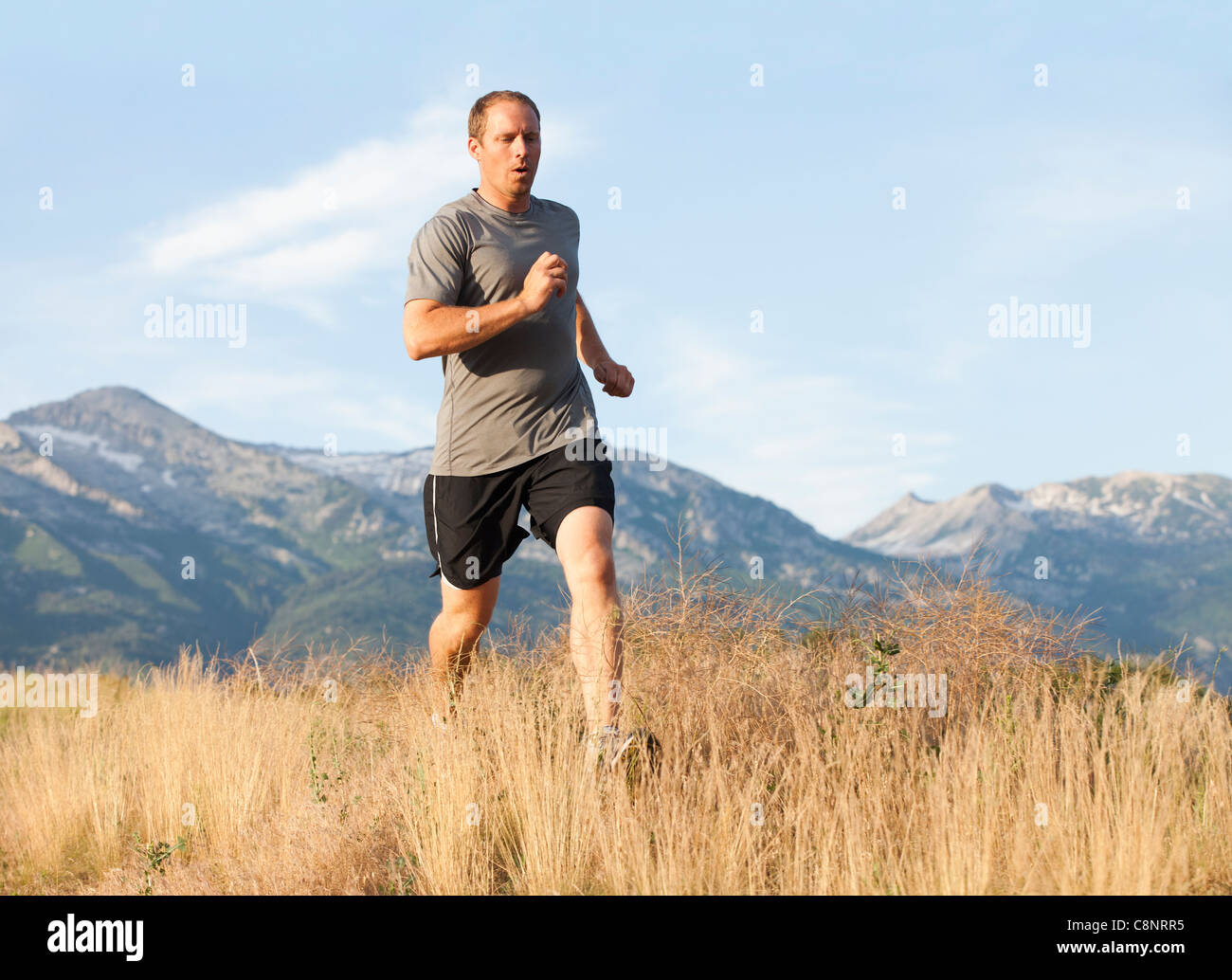 Man running away low hi-res stock photography and images - Alamy