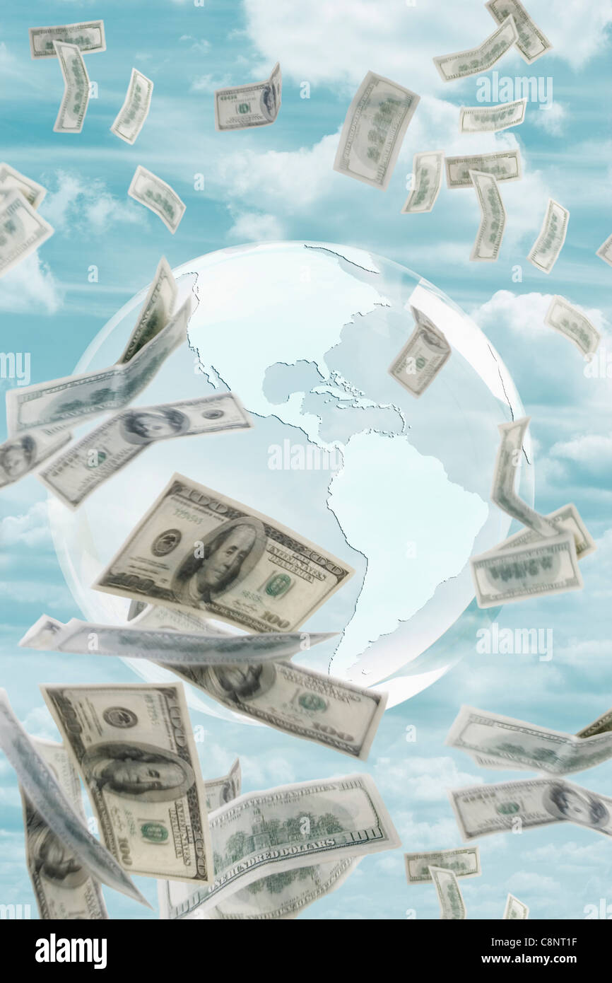 Globe and money floating in sky Stock Photo - Alamy