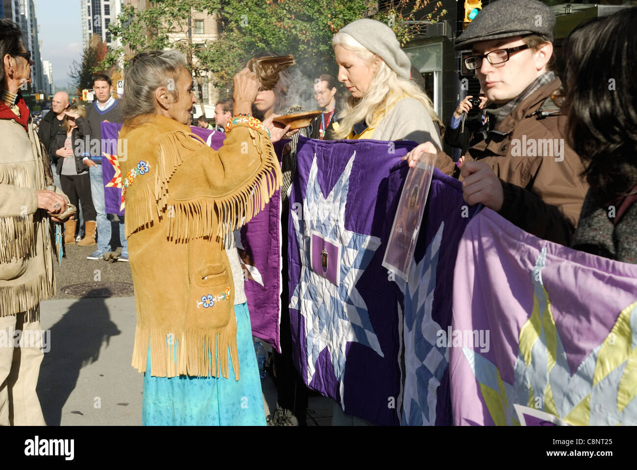 First Nation elder performing a smudging ceremony, a spiritual ritual ...