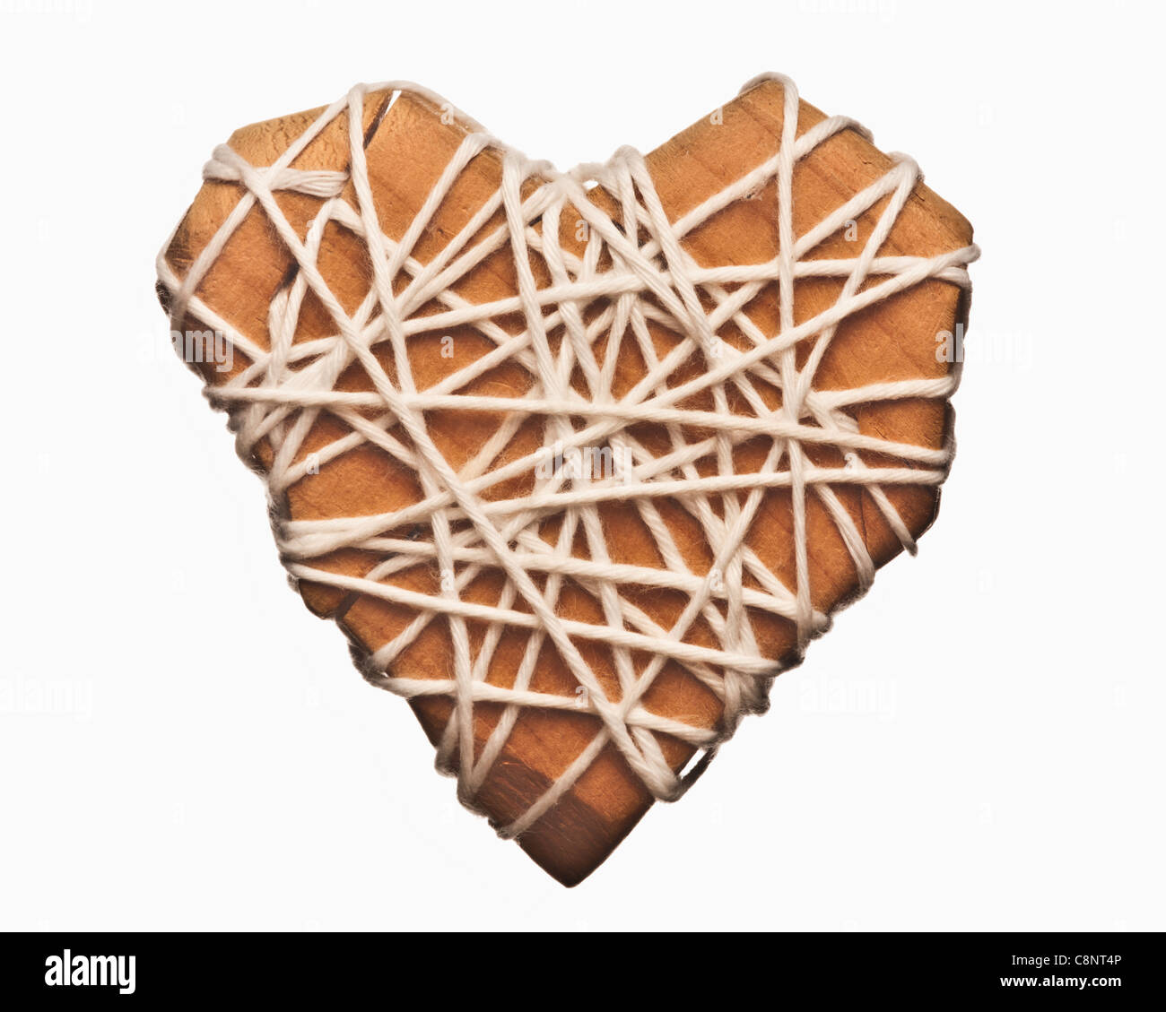 Wooden heart wrapped in string Stock Photo - Alamy