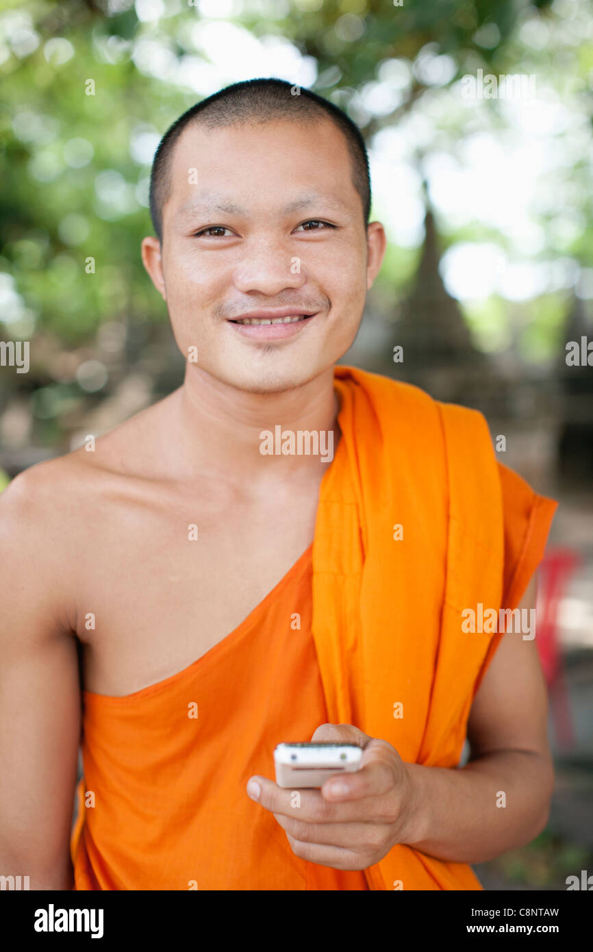 Cambodian monk text messaging on cell phone Stock Photo - Alamy