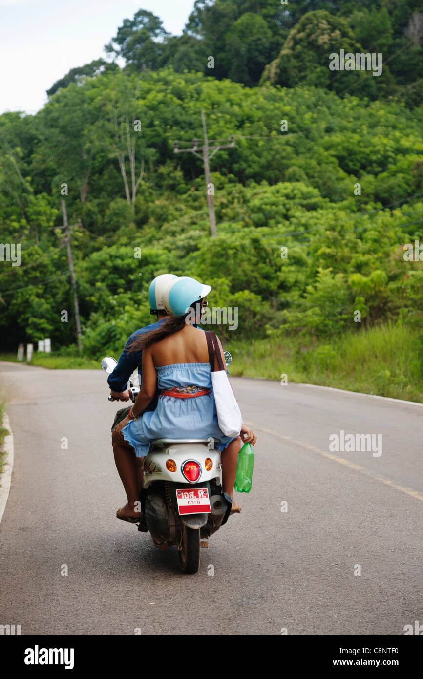 Rear view of young couple riding motorcycle hi-res stock photography ...
