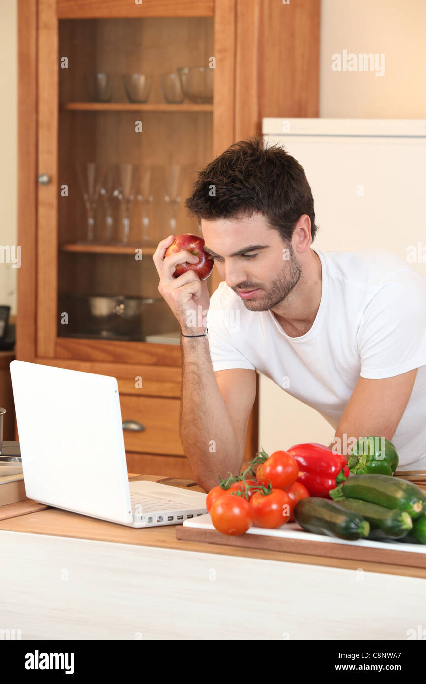 Man searching for a recipe Stock Photo - Alamy