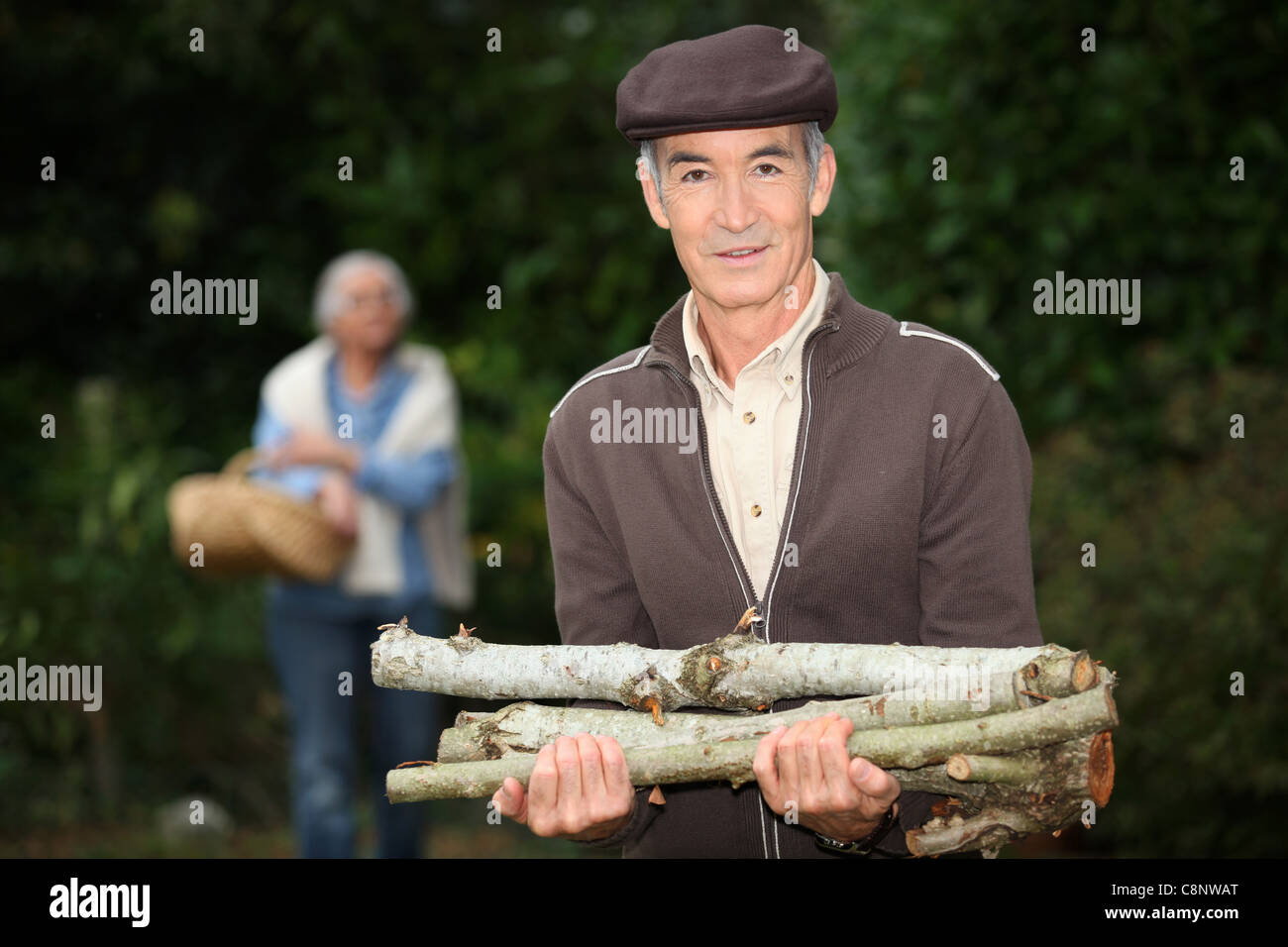 Man collecting wood Stock Photo - Alamy