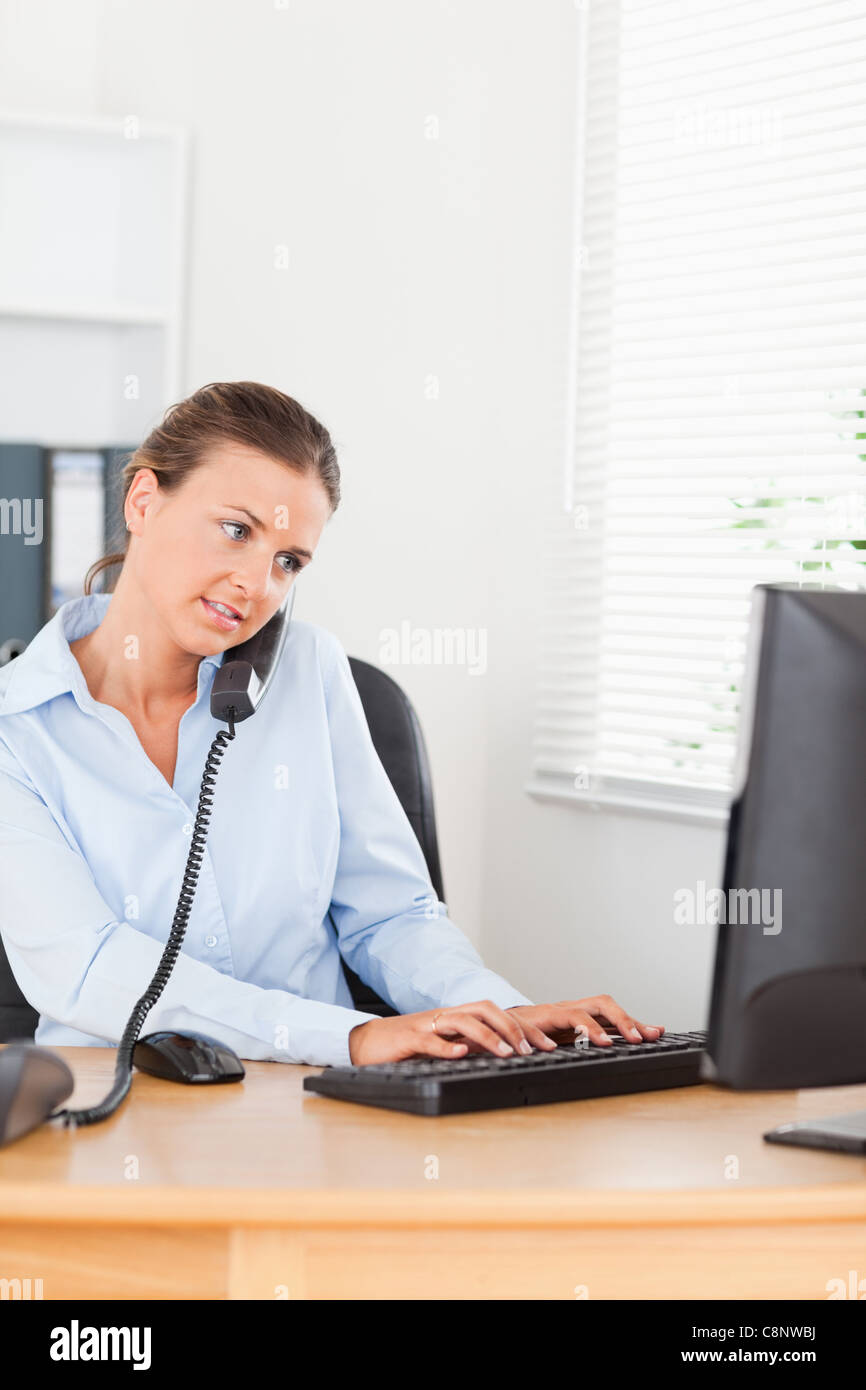 Busy working woman Stock Photo - Alamy