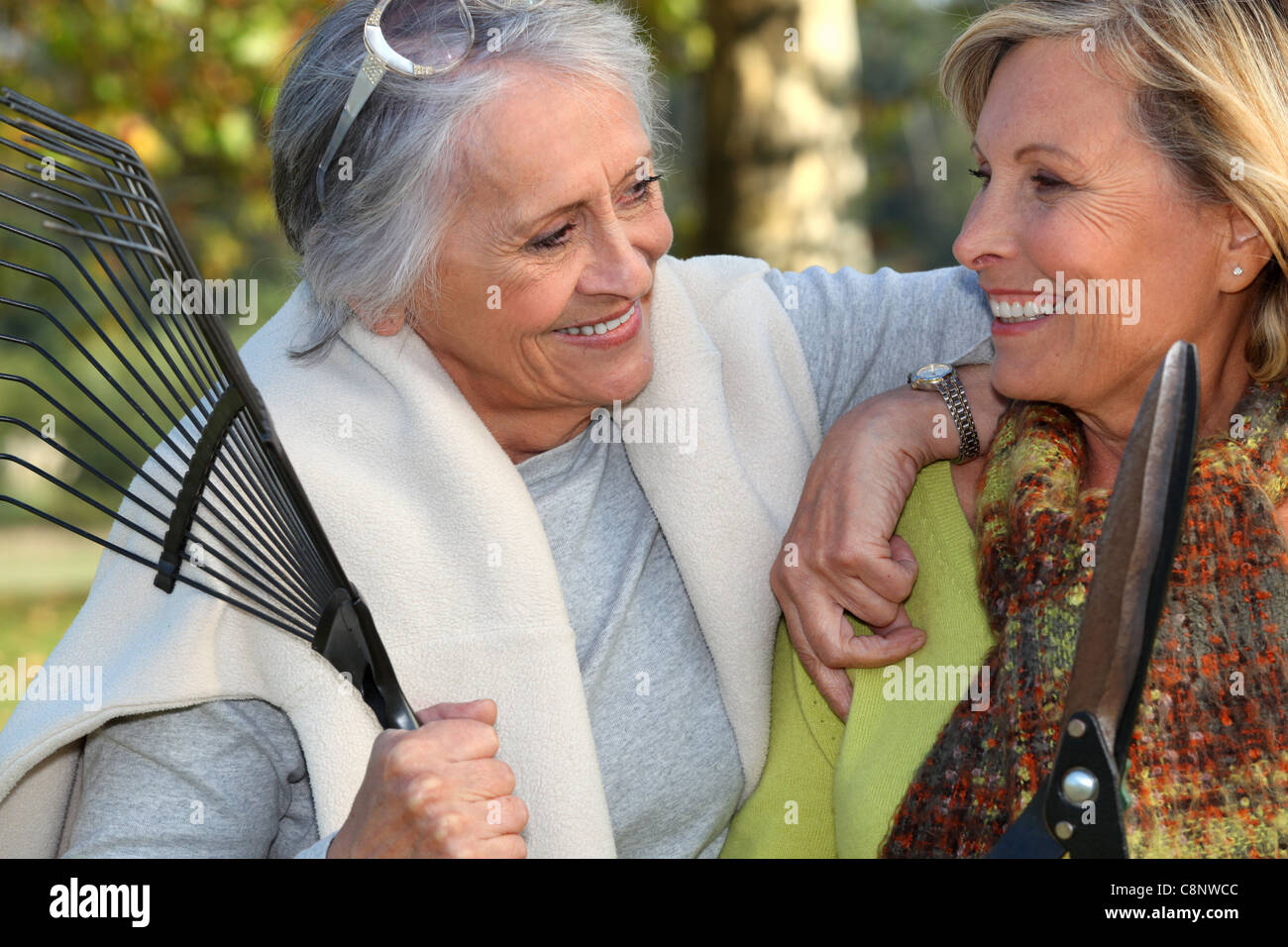 two senior friends gardening Stock Photo - Alamy