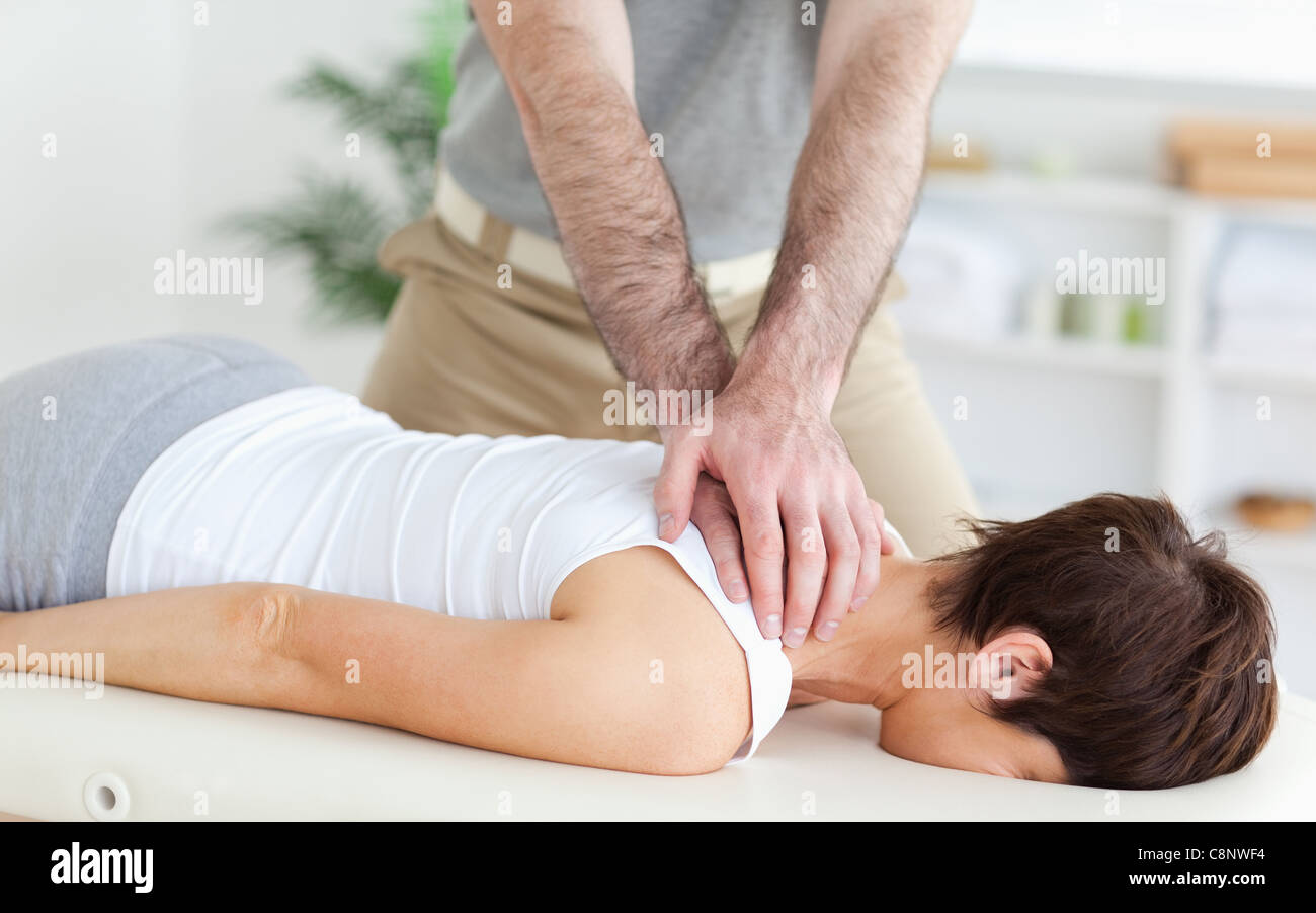 Man massaging a woman Stock Photo - Alamy