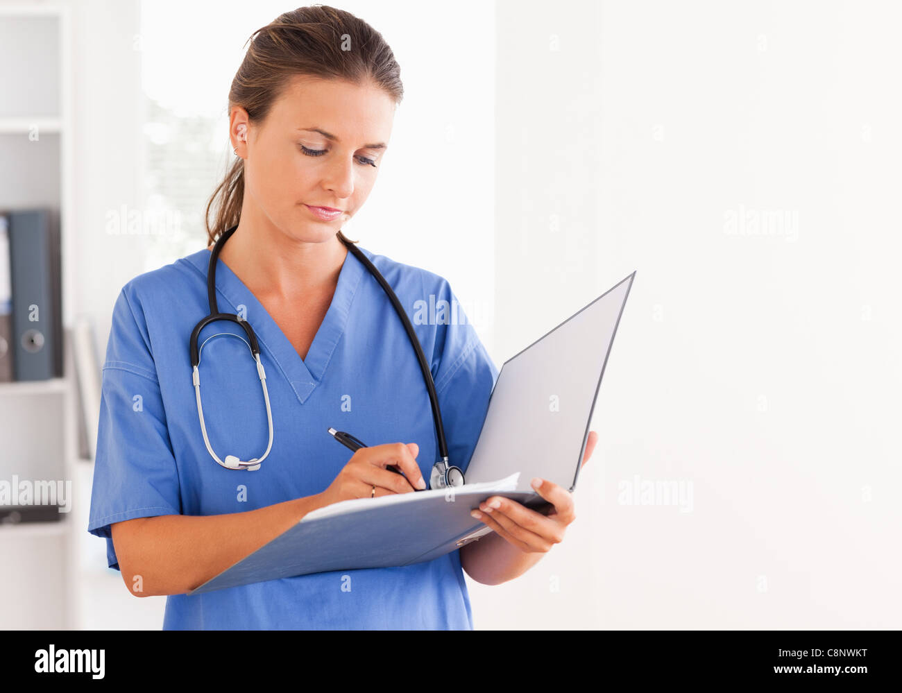 Doctor with stethoscope around neck Stock Photo - Alamy