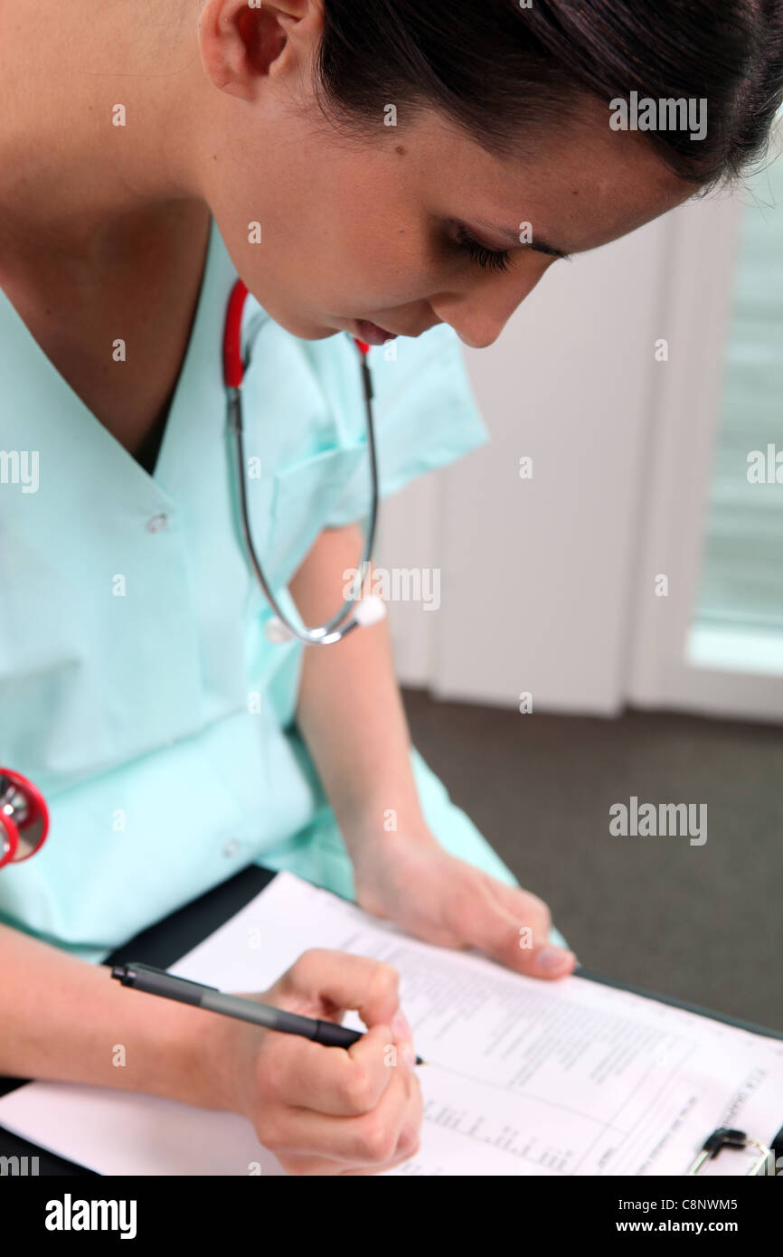 Nurse filling form hi-res stock photography and images - Alamy