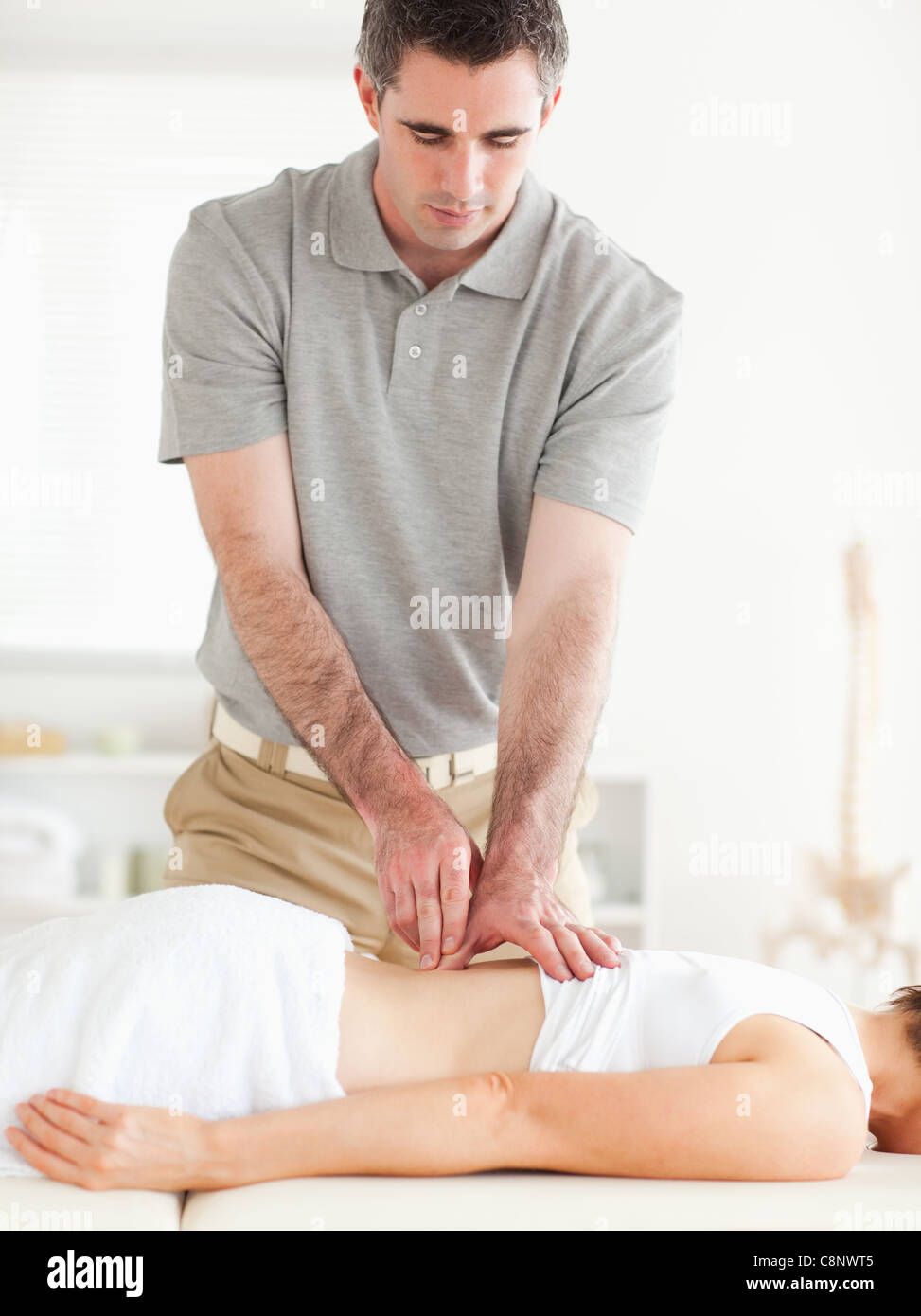 Gorgeous woman getting a back-massage Stock Photo - Alamy