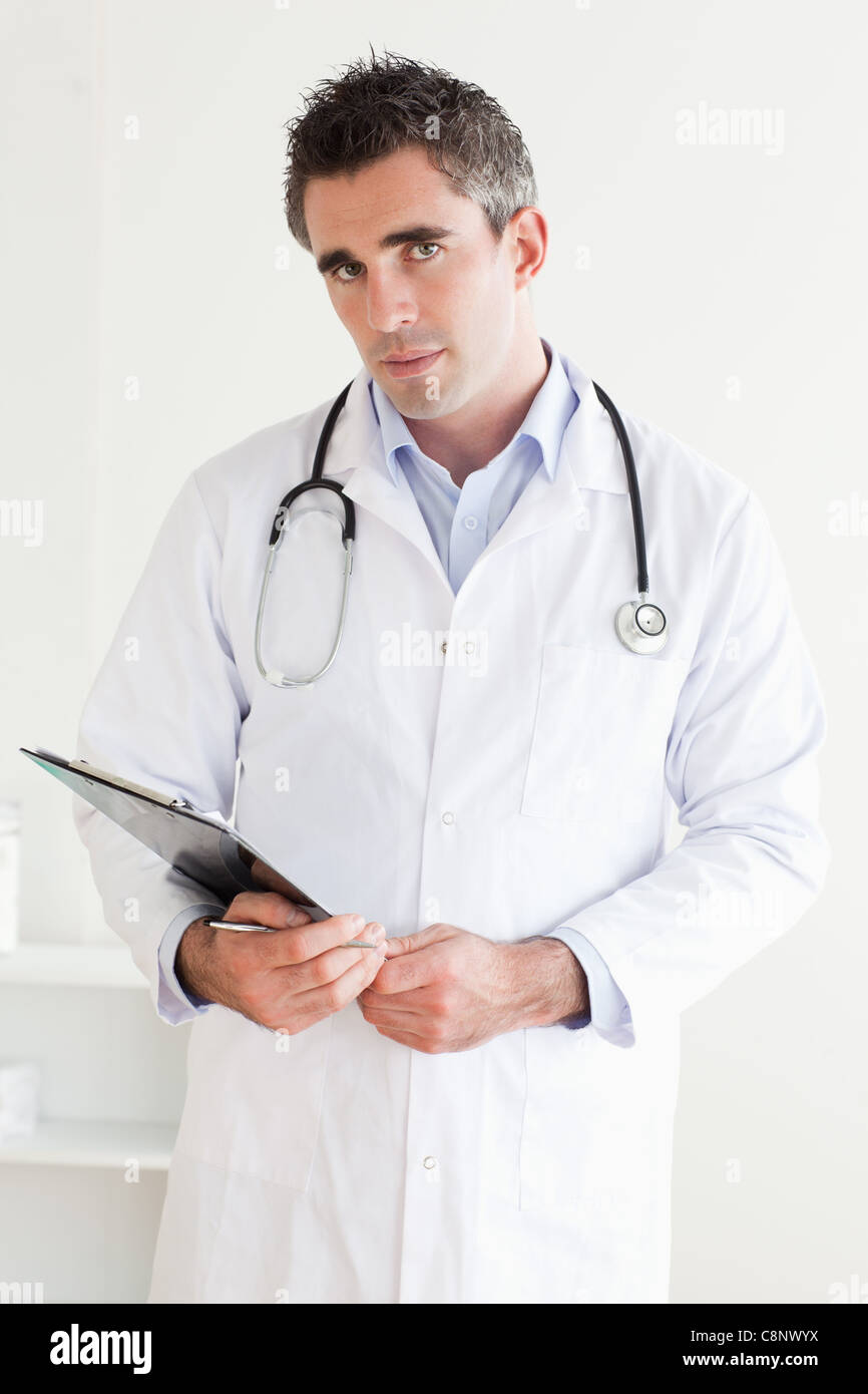 Male Doctor looking into the camera Stock Photo - Alamy