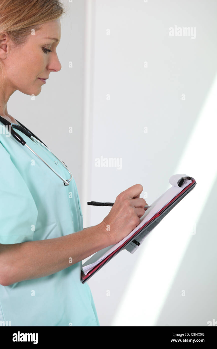 Nurse writing hi-res stock photography and images - Alamy