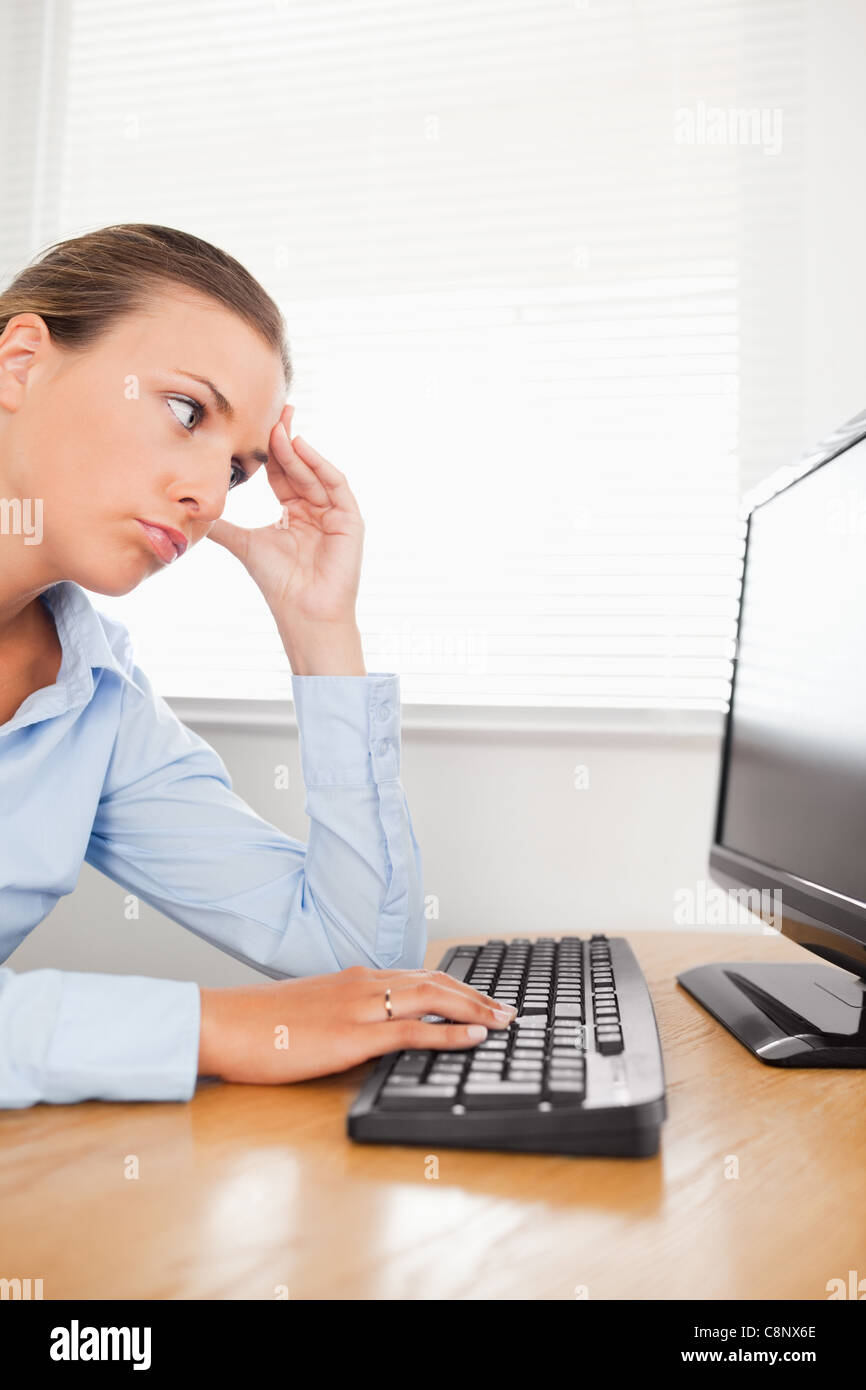 Sad businesswoman looking to screen of her pc Stock Photo - Alamy