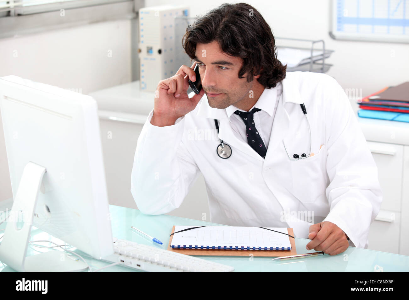 Doctor at his desk Stock Photo - Alamy