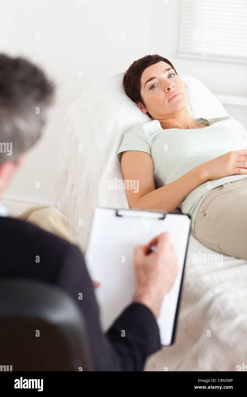 Psychologist talking to a sad female patient Stock Photo - Alamy