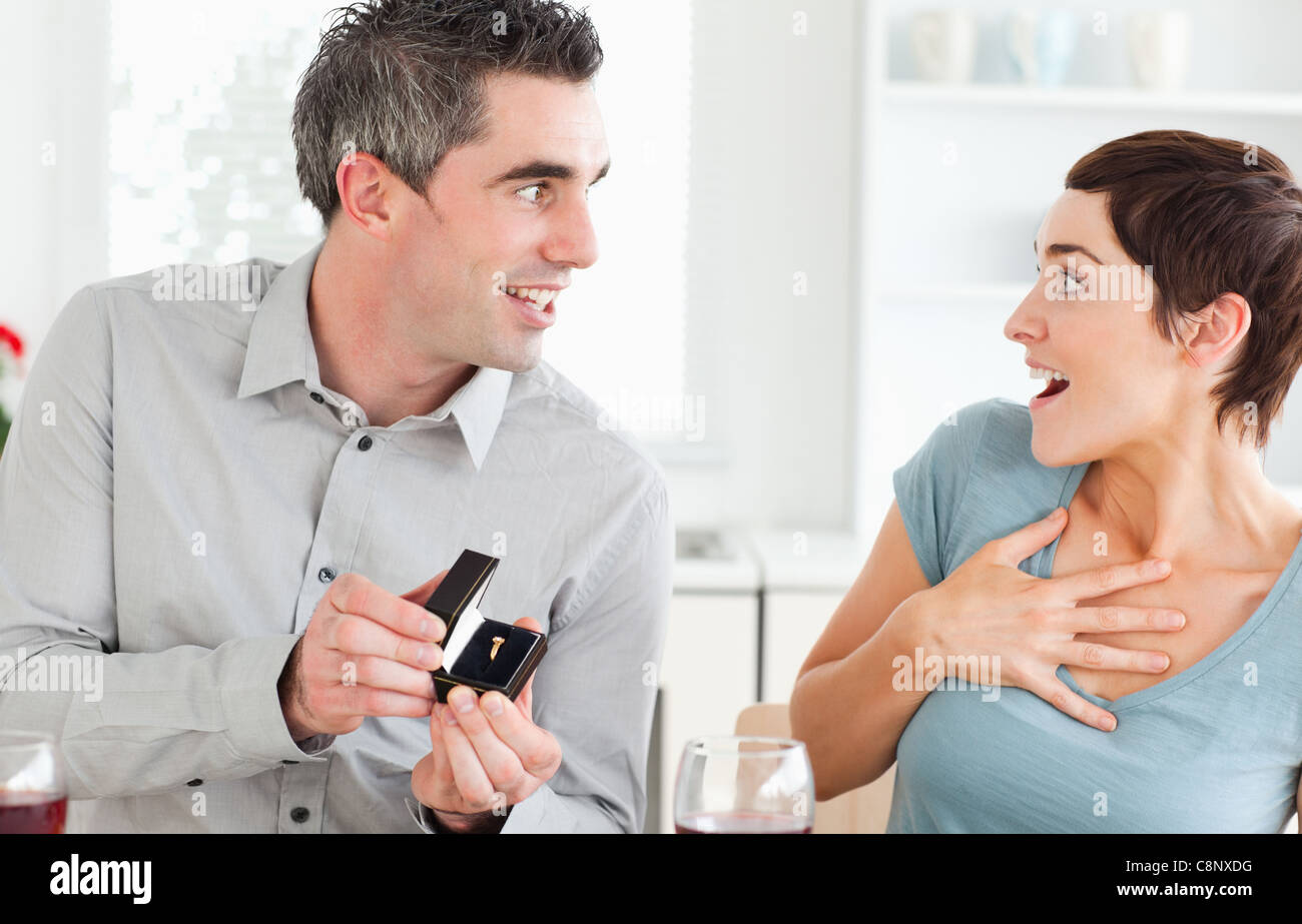 Man proposing to his surprised girlfriend Stock Photo - Alamy