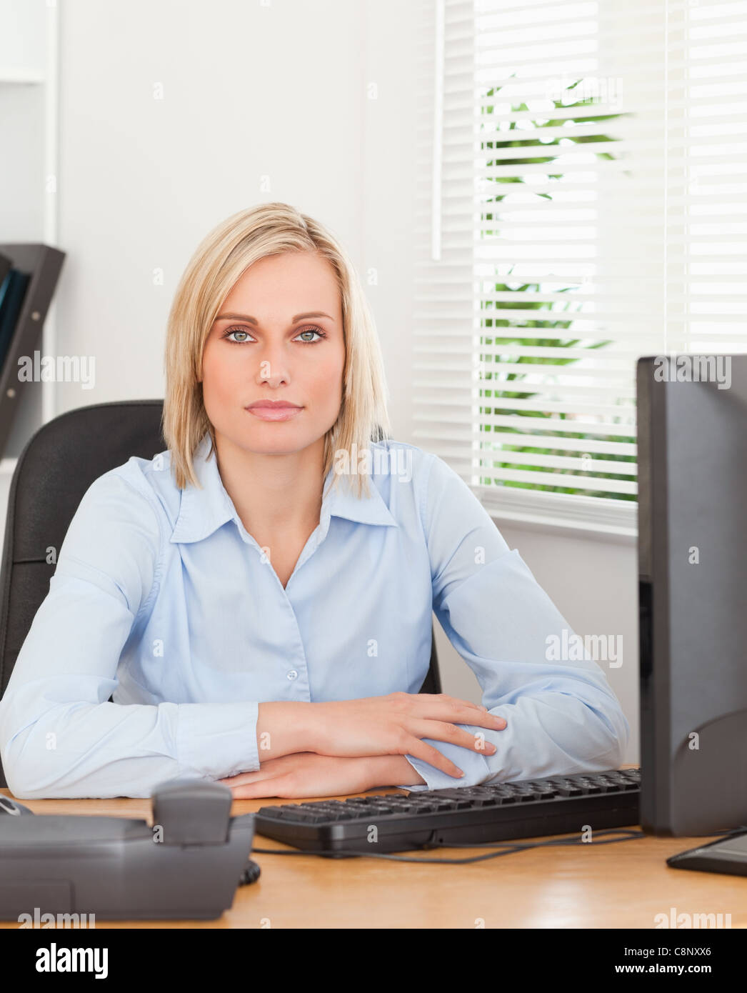 Blonde woman behind desk hi-res stock photography and images - Alamy