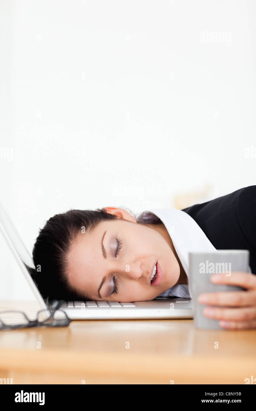 Businesswoman sleeping in office chair hi-res stock photography and ...