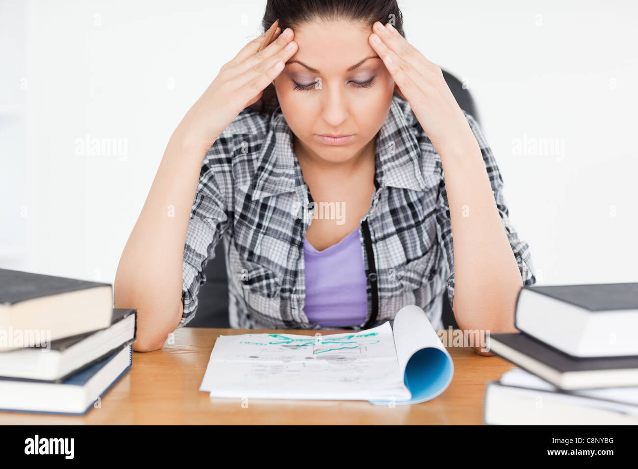 Exhausted student trying to learn Stock Photo - Alamy