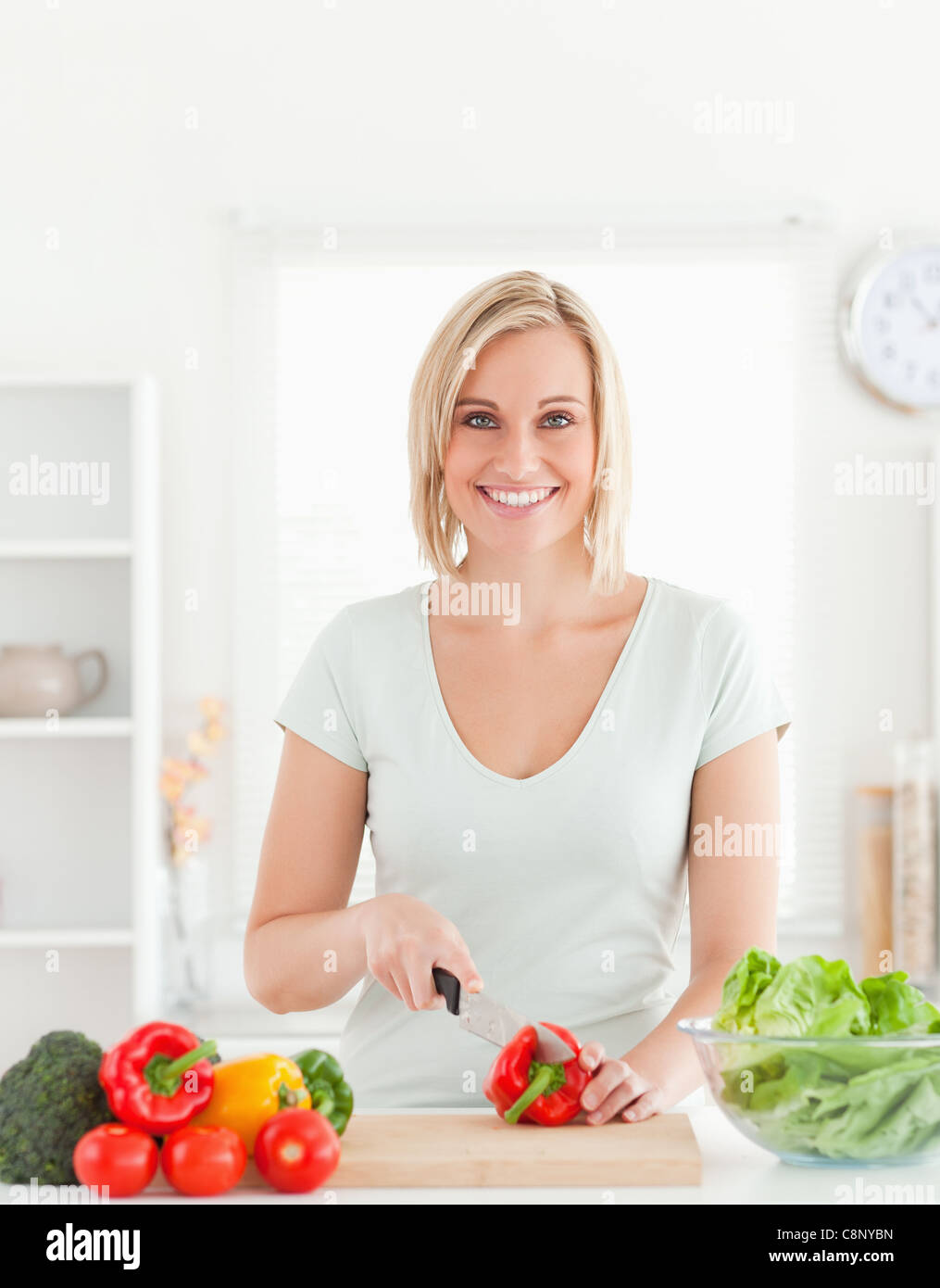 Young woman cutting vegetables Stock Photo - Alamy