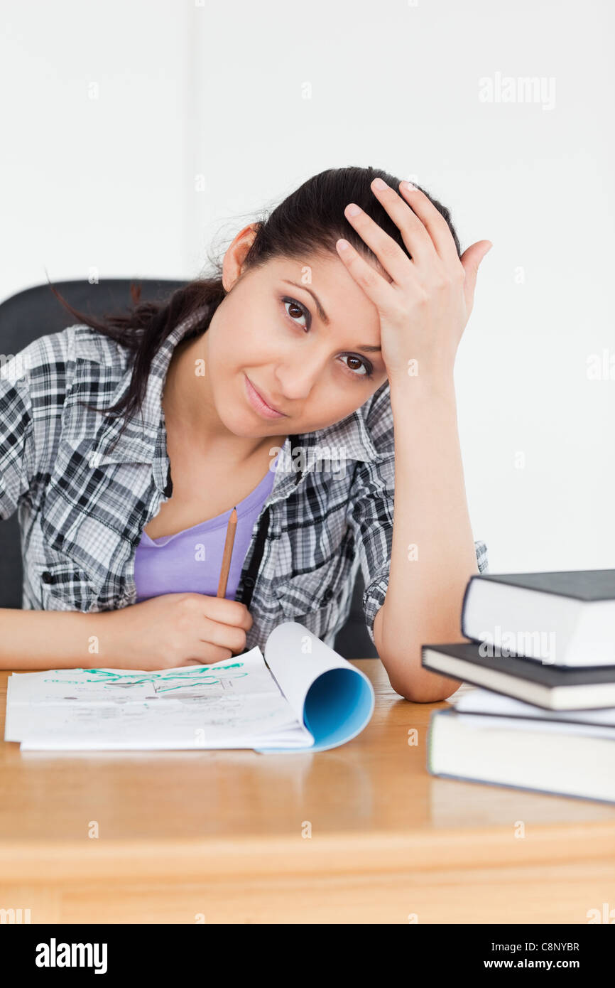 Smiling student with homework Stock Photo - Alamy