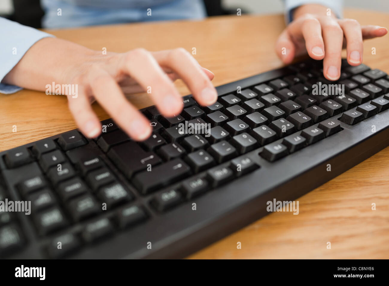 Woman typing on keyboard Stock Photo - Alamy