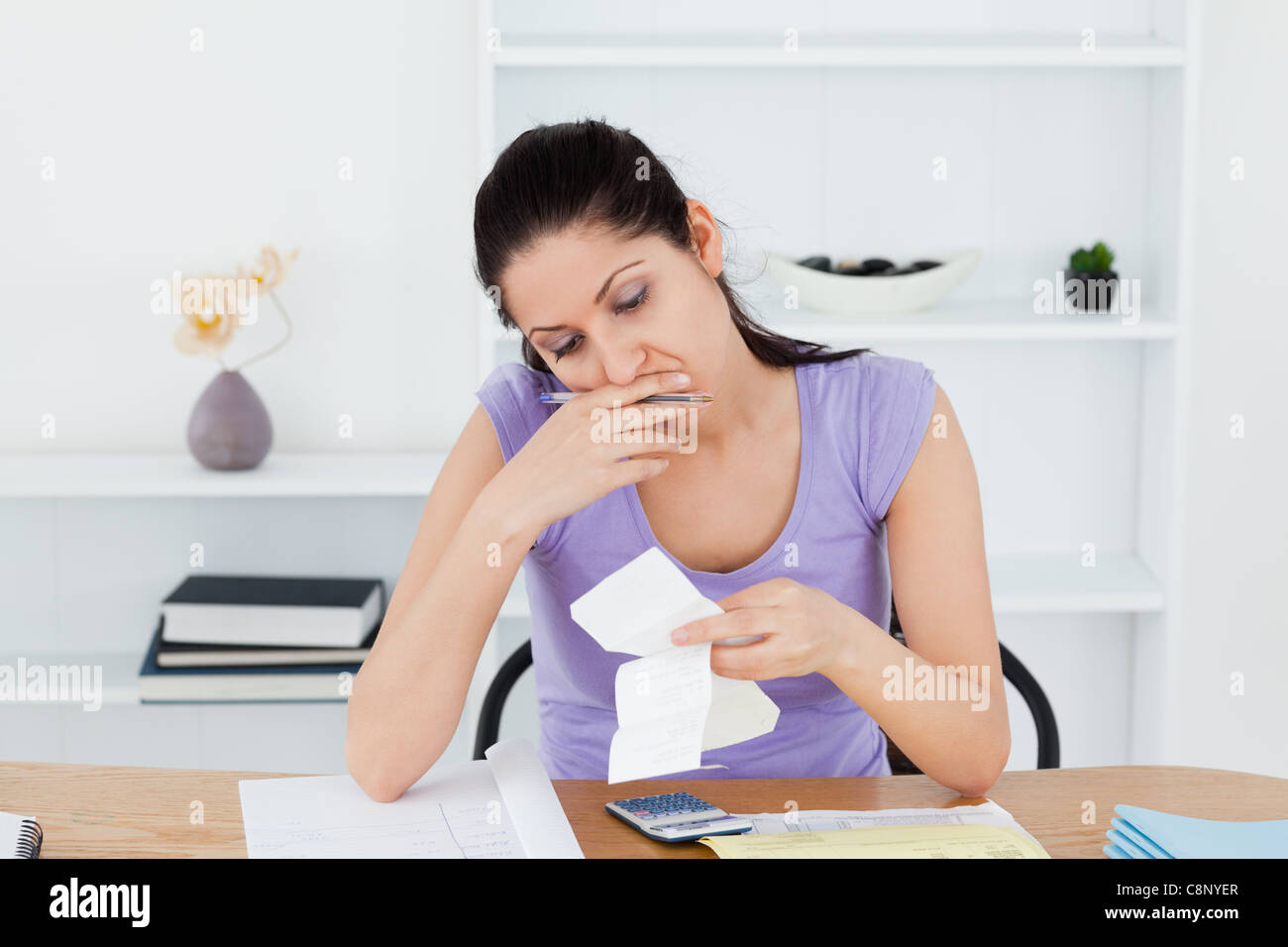 Stressed young woman doing banking Stock Photo - Alamy