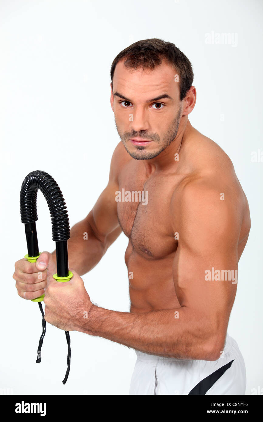 Man bending a bar Stock Photo - Alamy