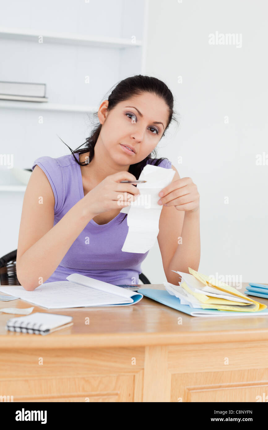 Bored looking woman accounting Stock Photo - Alamy