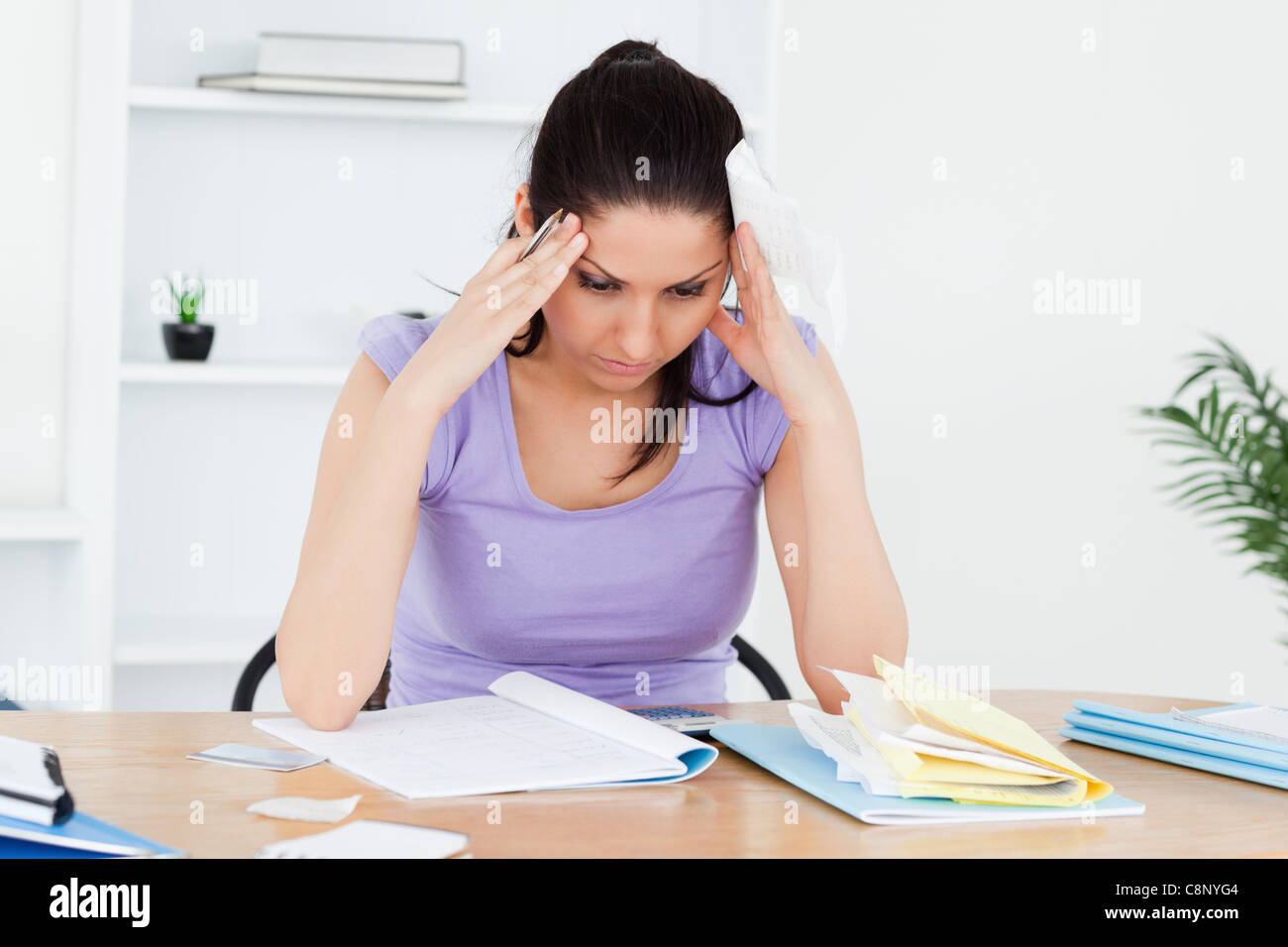Stressed young woman accounting Stock Photo - Alamy