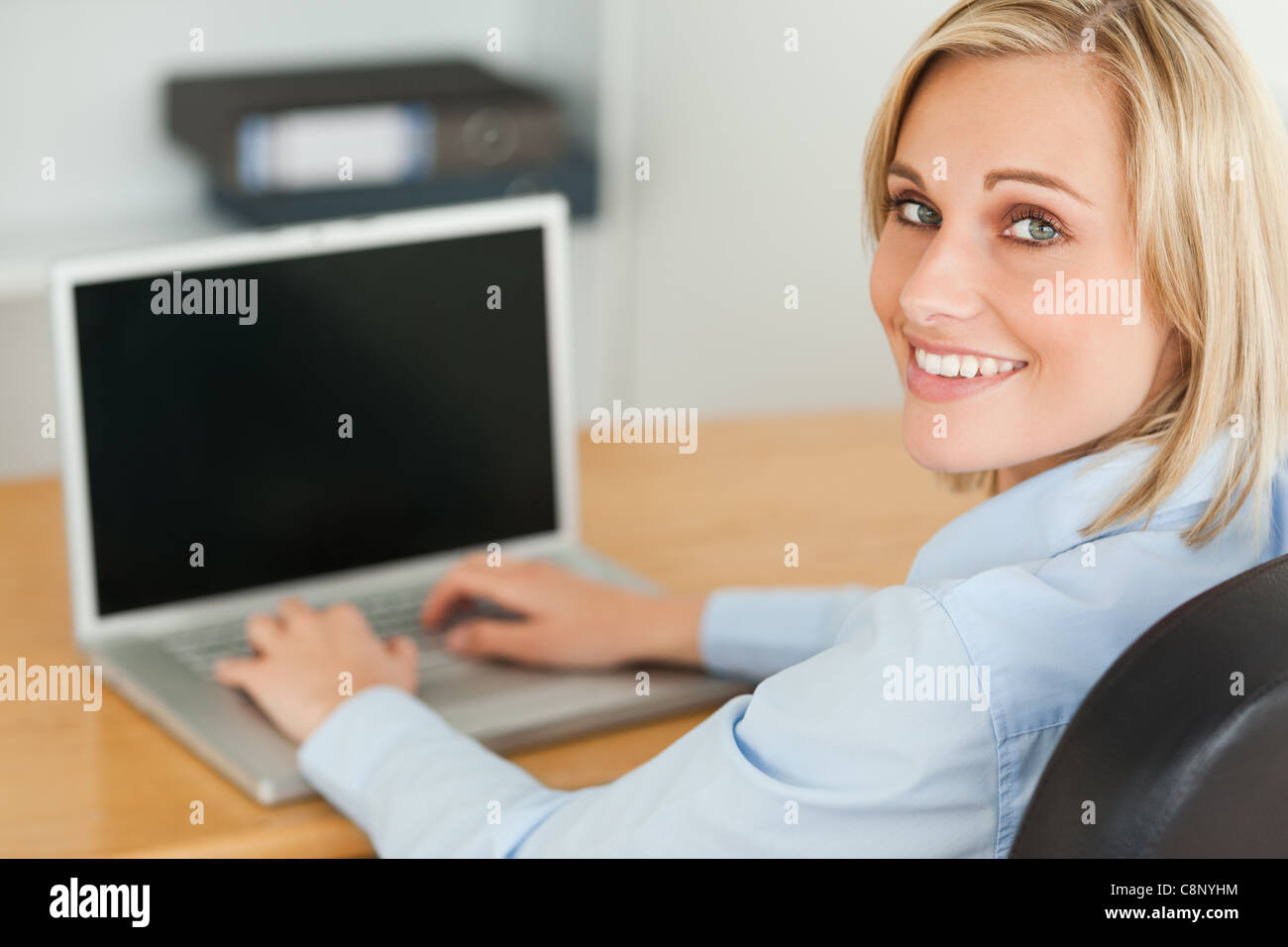 Blonde businesswoman smiling into camera Stock Photo - Alamy