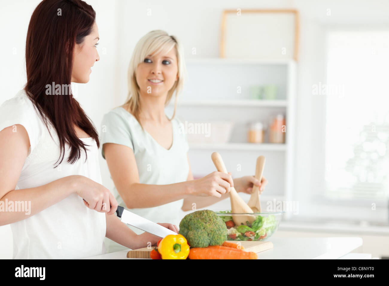 Young Women preparing dinner Stock Photo - Alamy