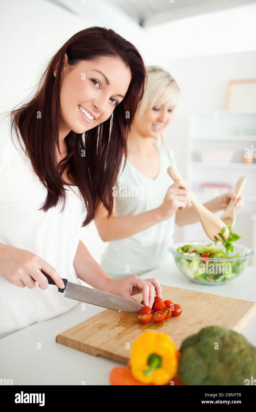 Cute Women preparing dinner Stock Photo - Alamy